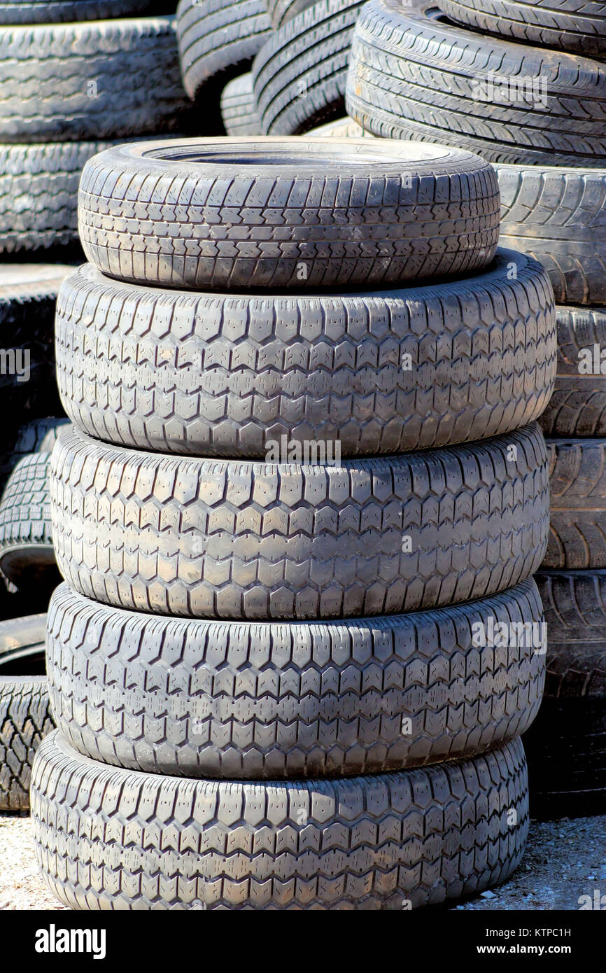 Old used tires at recycling centre/landfill Stock Photo - Alamy