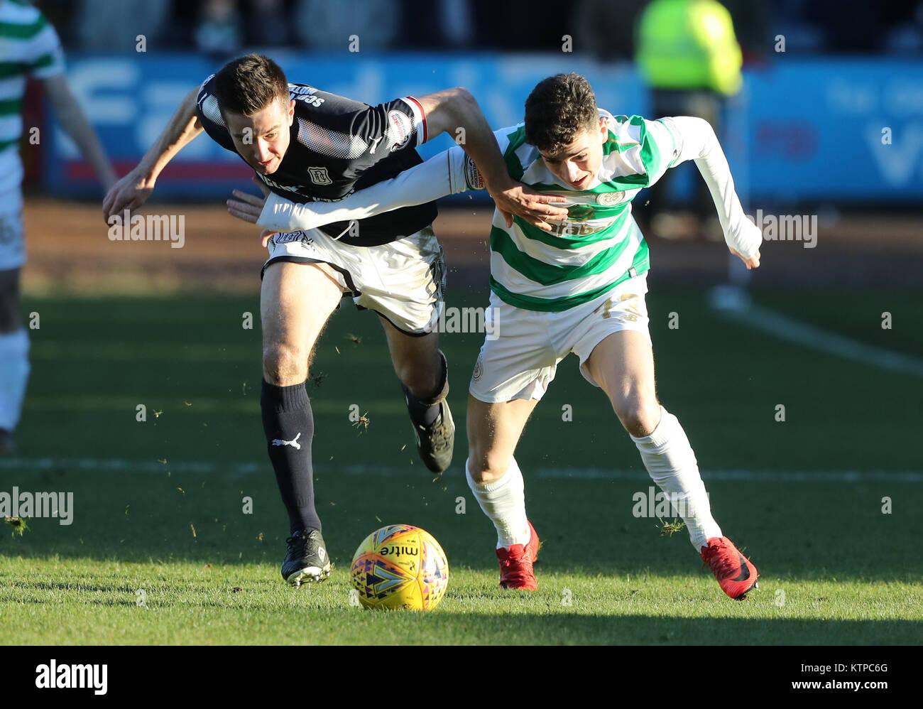 Celtic's Michael Johnston (right) and Dundee's Cammy Kerr battle for ...