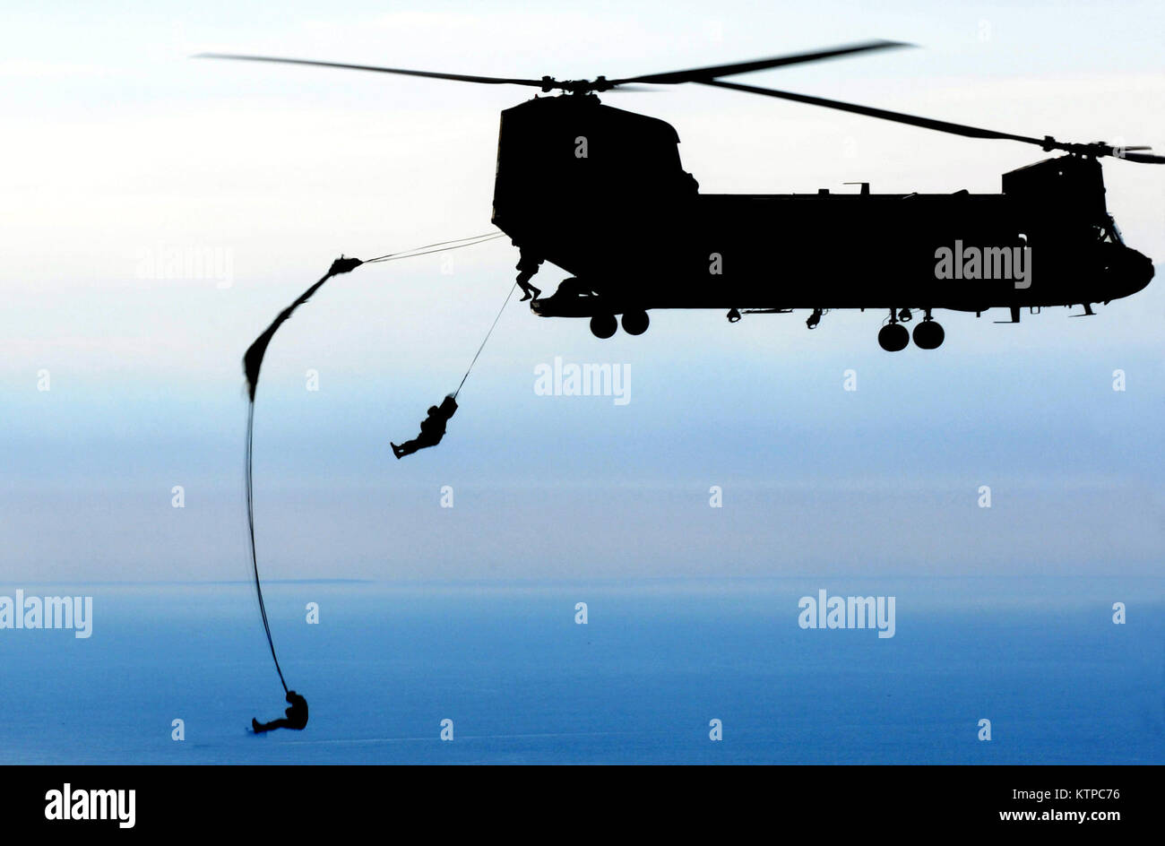 Soldiers jump from a CH-47 Chinook helicopter above Kingston, R.I ...