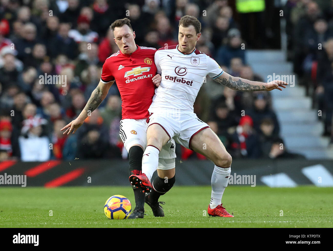 Manchester United's Phil Jones (left) and Burnley's Ashley Barnes ...