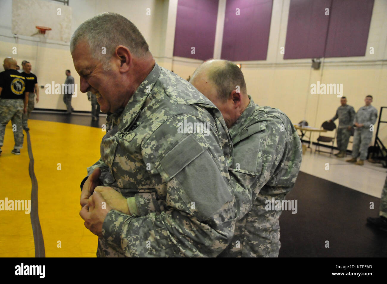 Sgt.Maj. Chris Olmsted braces Master Sgt. Robert Vergith, Jr. from ...