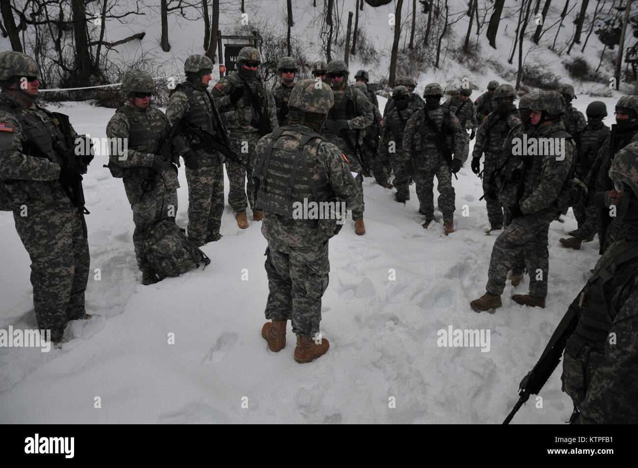 A platoon of 42nd Infantry Division Soldiers are given instruction ...