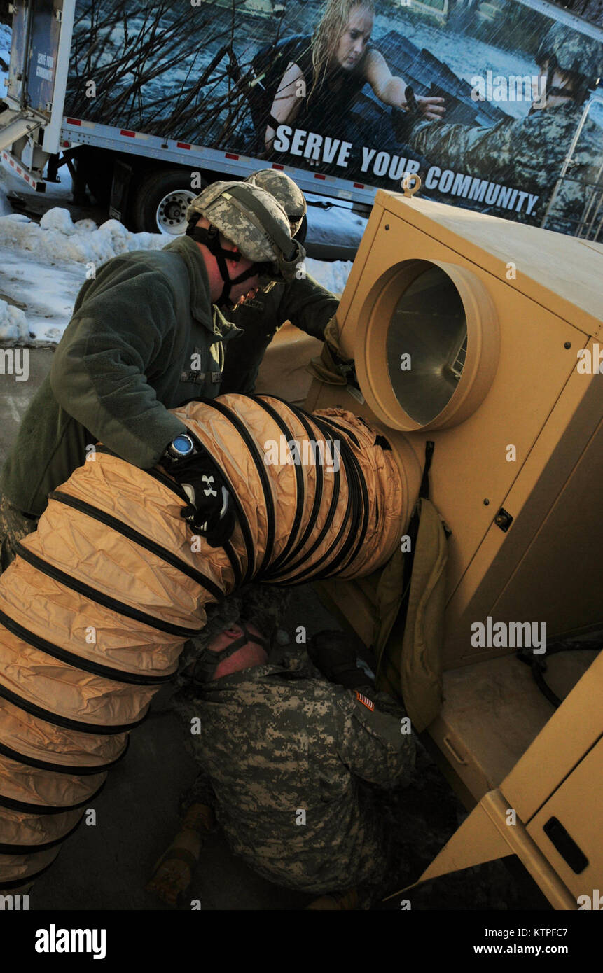 42nd Infantry Soldiers work to assemble a heating/cooling trailer ...