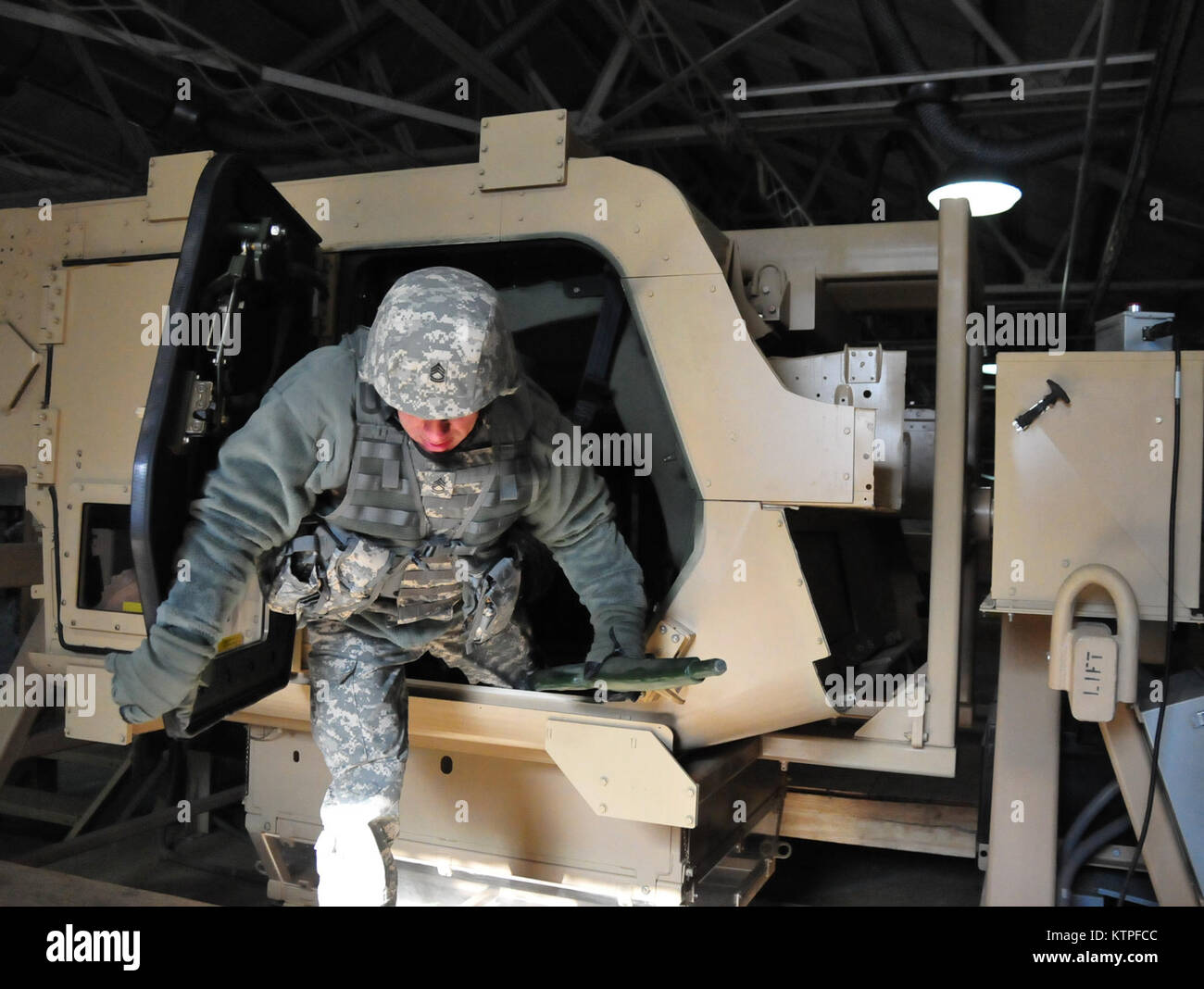 A 42nd Infantry Division Soldier emerges from the Humvee rollover ...