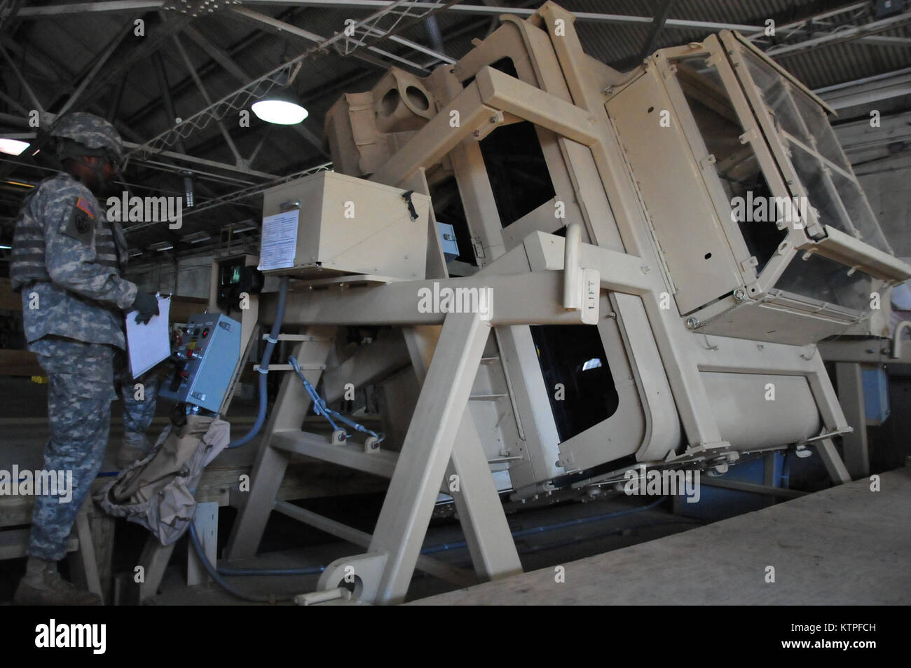 Sgt. Ray Adepegba operates the controls of the Humvee rollover training ...