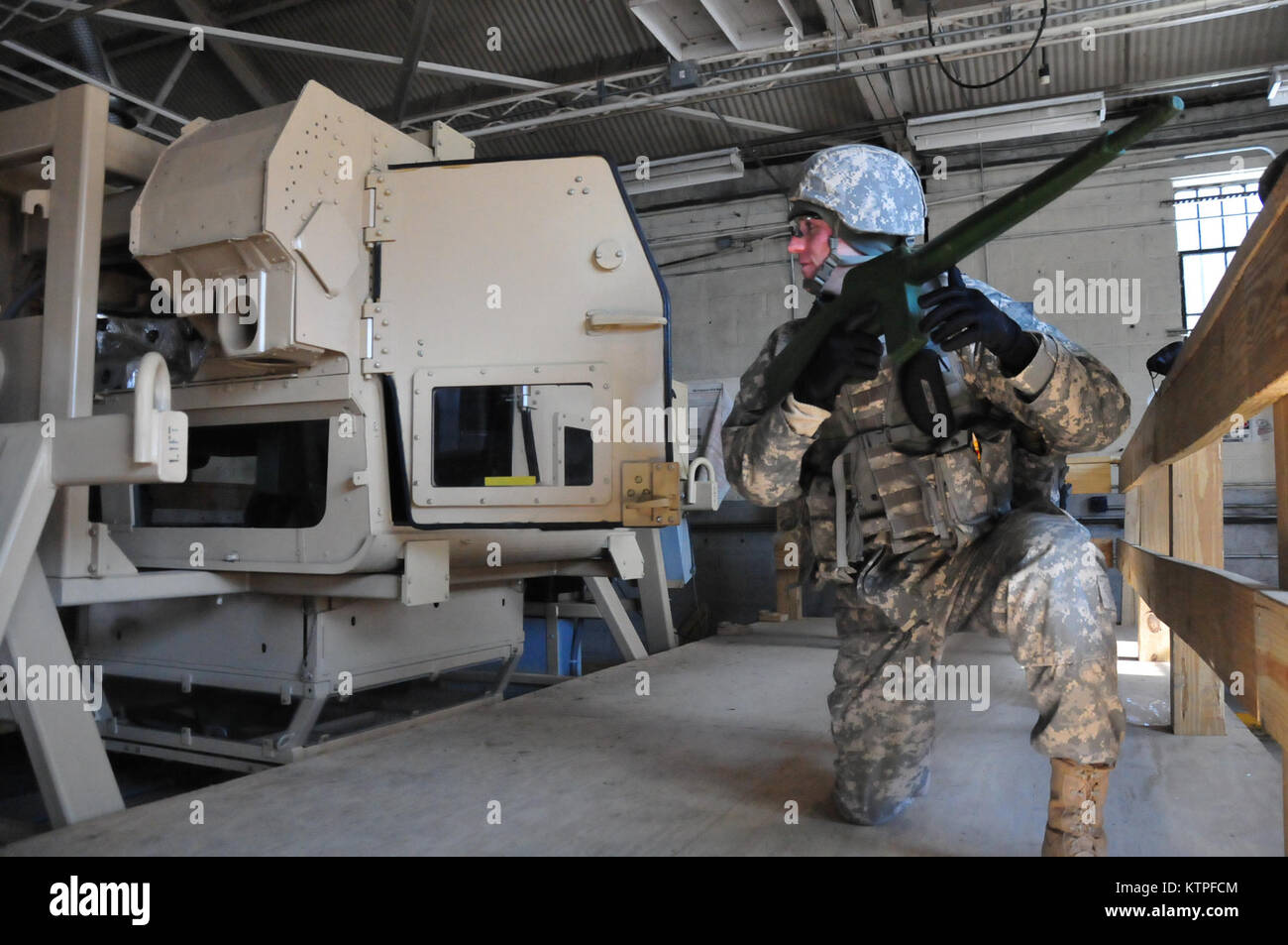 A 42nd Infantry Division Soldier emerges from the Humvee rollover ...