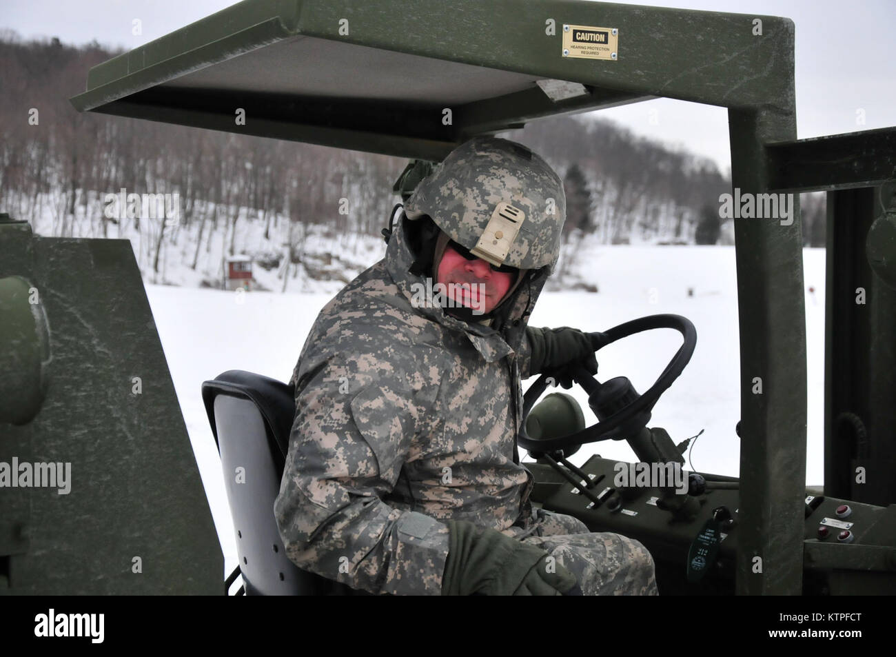 Staff Sgt. Antonio Gonzalez operates a military fort lift to assist ...