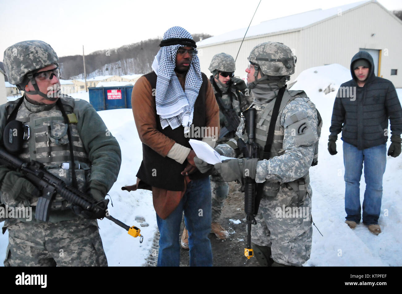 42nd Infantry Division Soldiers arrive in a mock village to question a ... 42nd Infantry Division Soldiers arrive in a mock village to question a ...