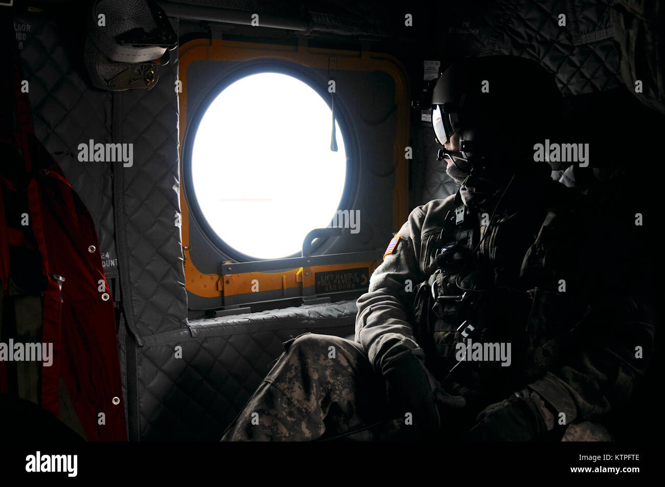 SYRACUSE, NY – A CH-47 Chinook crew chief looks over Central New York ...