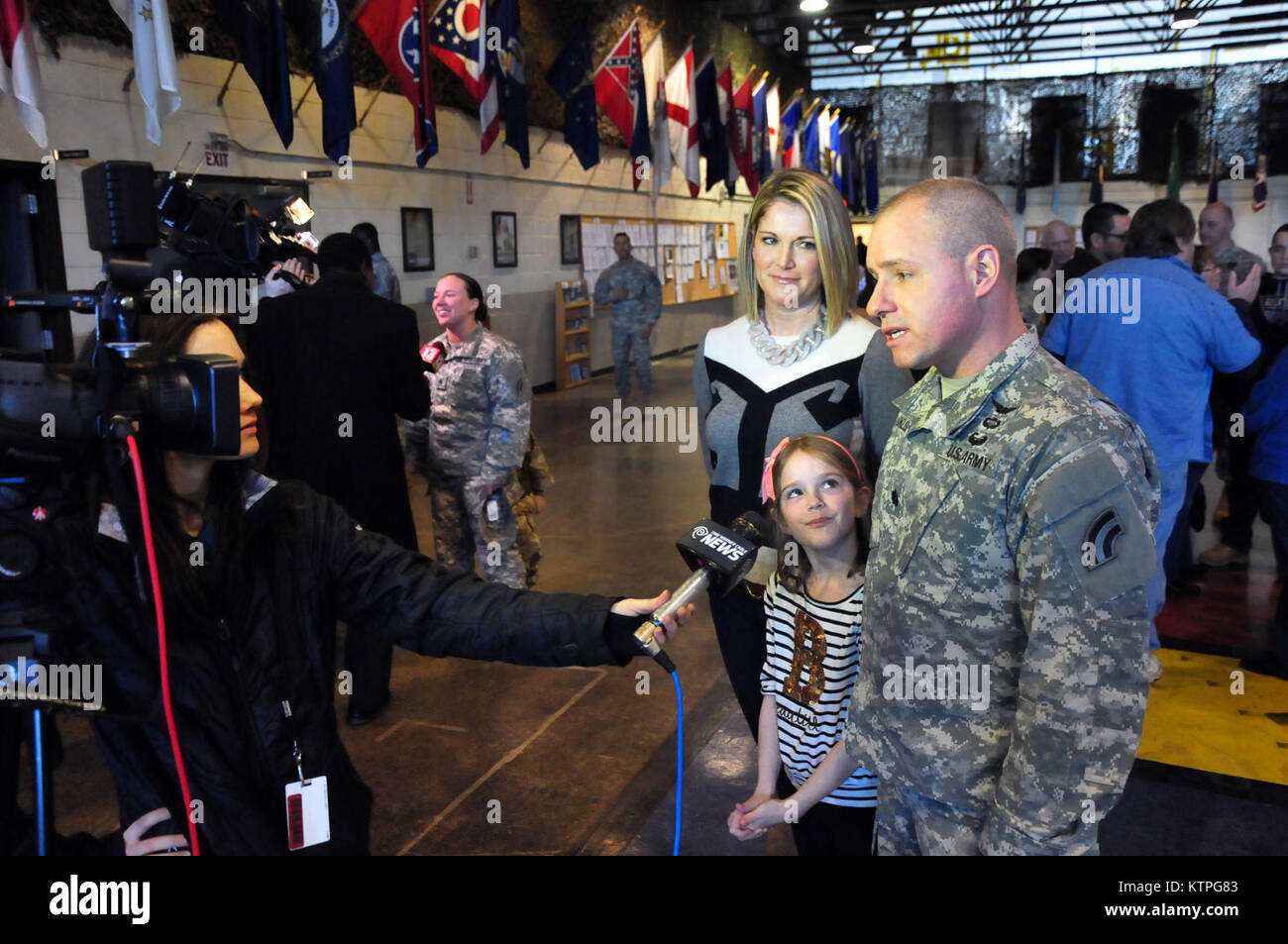A Time Warner Cable reporter interviews Lt. Col. Todd Bookless and his ...