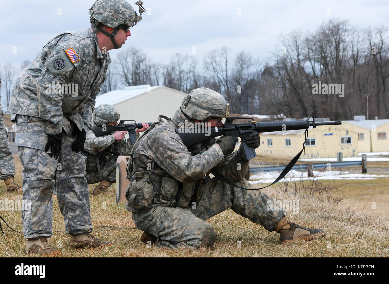 Pfc. Vincente Torres (left background), a soldier with the 27th ...