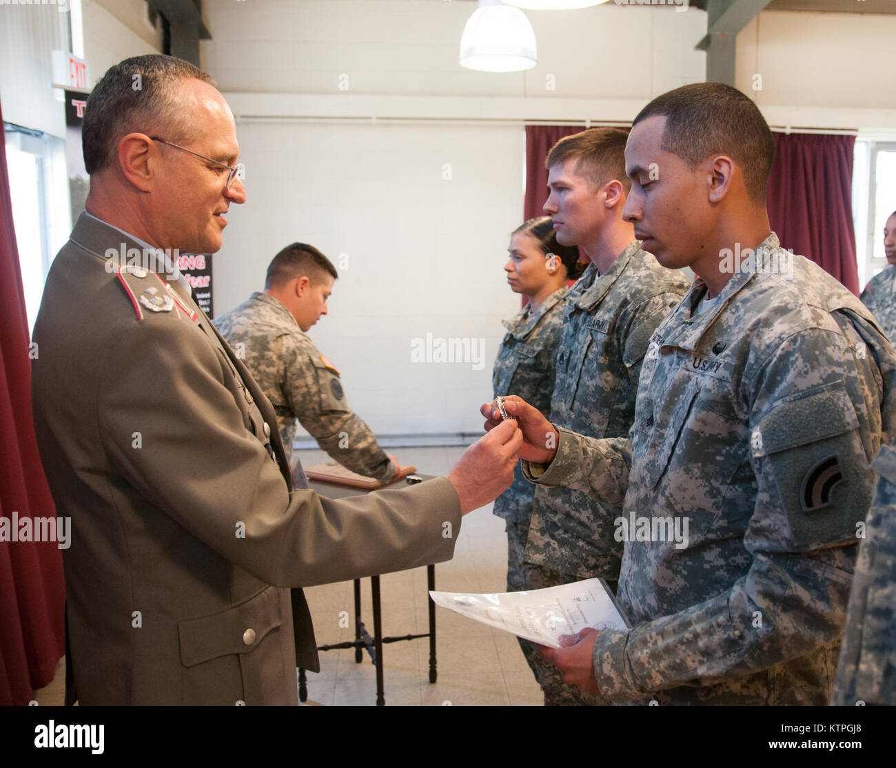 Lt. Col. Rolfe K. Metz of the German Army presents the German ...