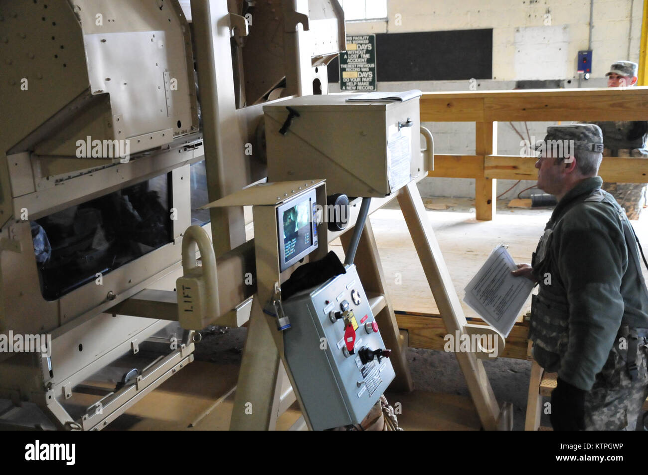 Sgt. 1st Class Steven Petibone checks to ensure all doors are unlocked ...