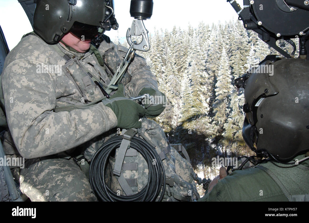 Military helicopter winch crew Stock Photo - Alamy