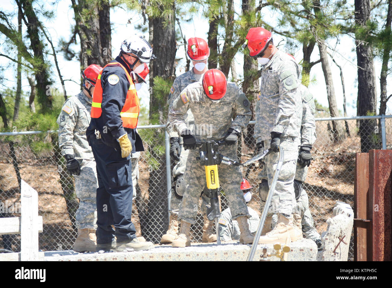 U.S. Army Pfc. Dandy Beverly uses a jack hammer to break through ...