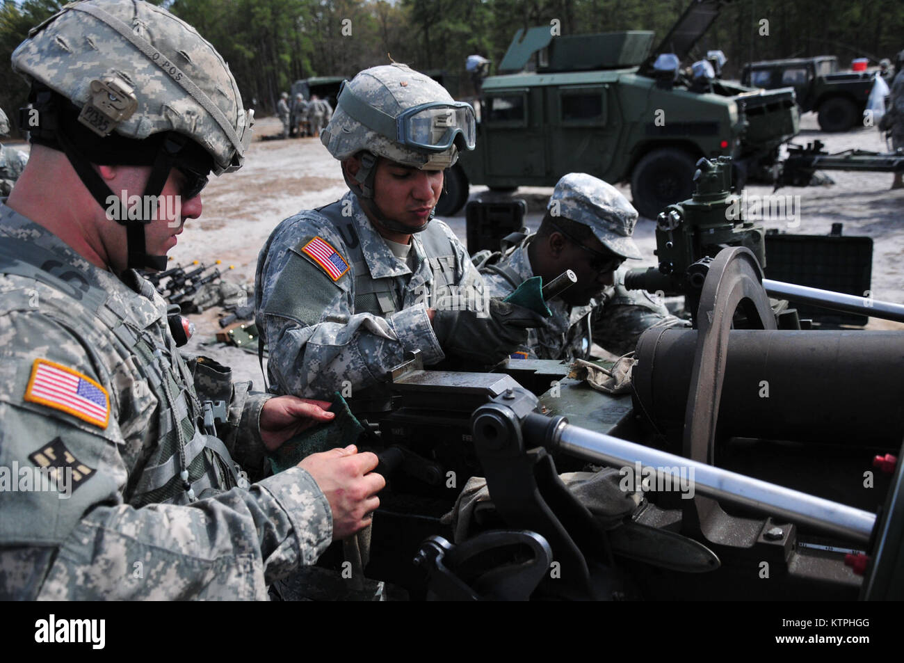 Battery B, 258th Field Artillery Soldiers lubricate and clean thier ...