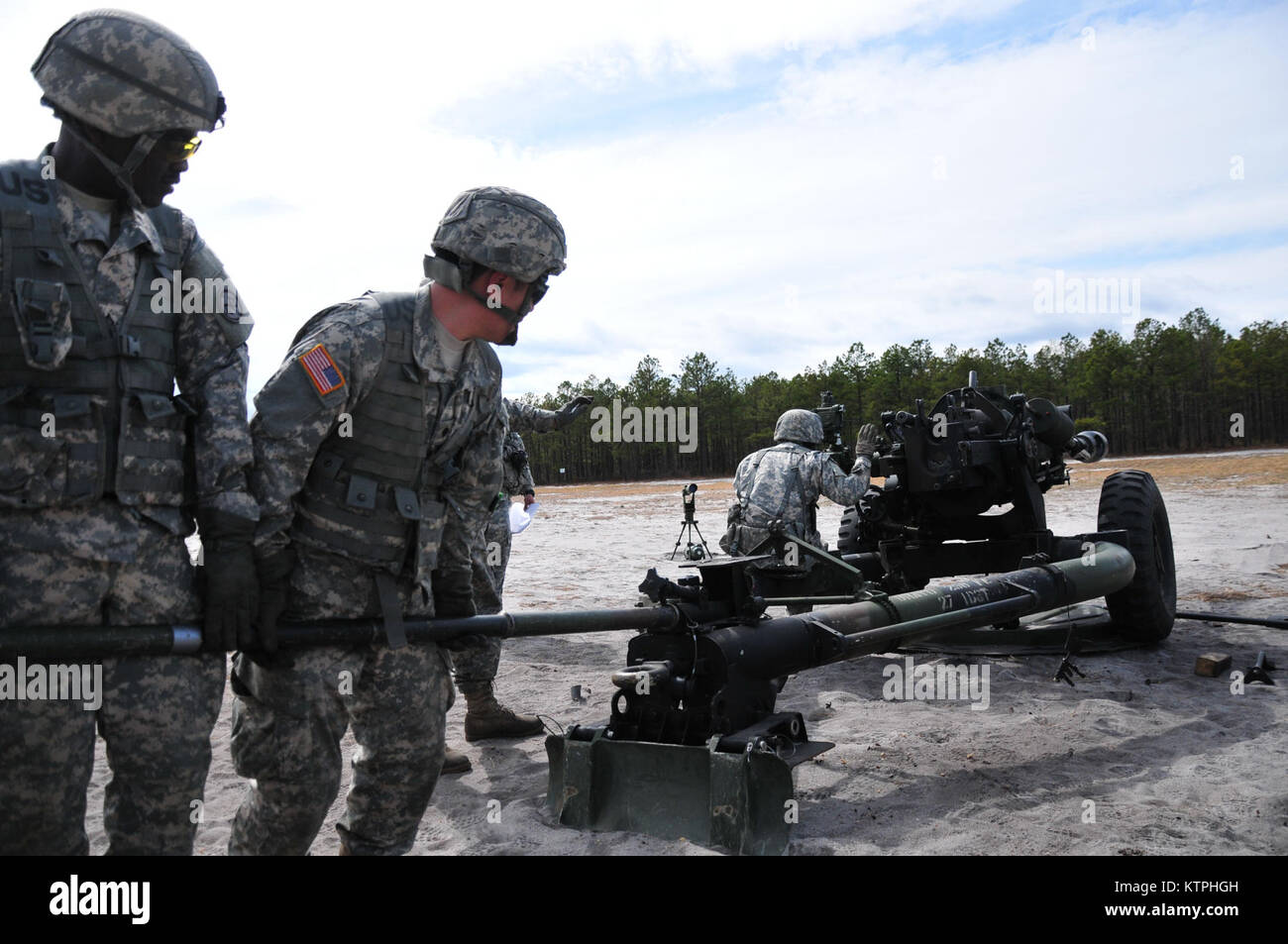 Battery B, 258th Field Artillery Soldiers move thier howitzer shortly ...