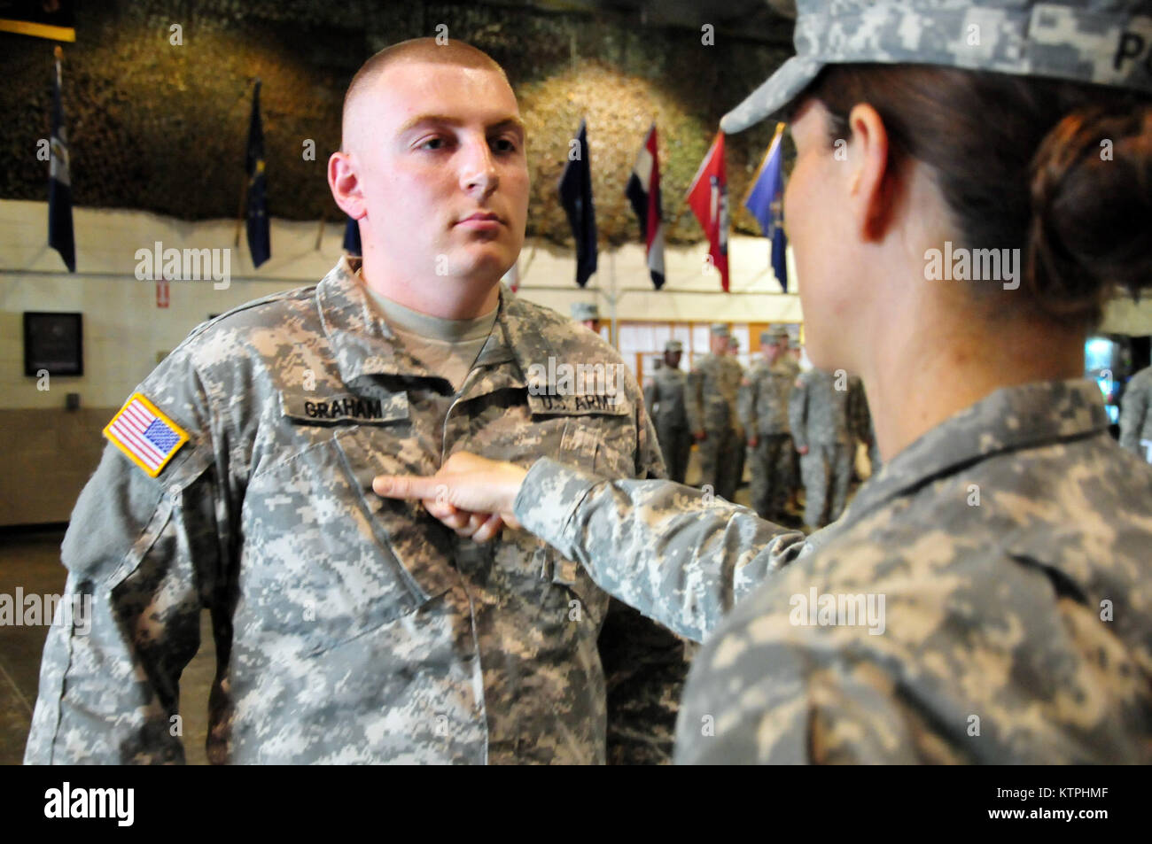 TROY -- Pfc. Graham, 42nd Infantry Division, is promoted to Spc. by ...