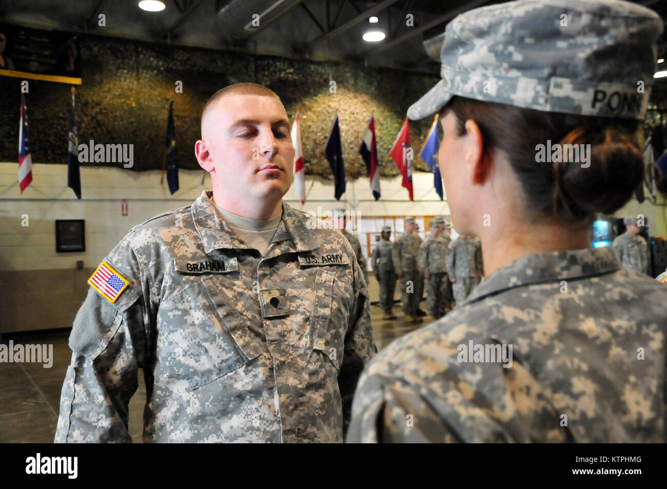 TROY -- Pfc. Graham, 42nd Infantry Division, is promoted to Spc. by ...