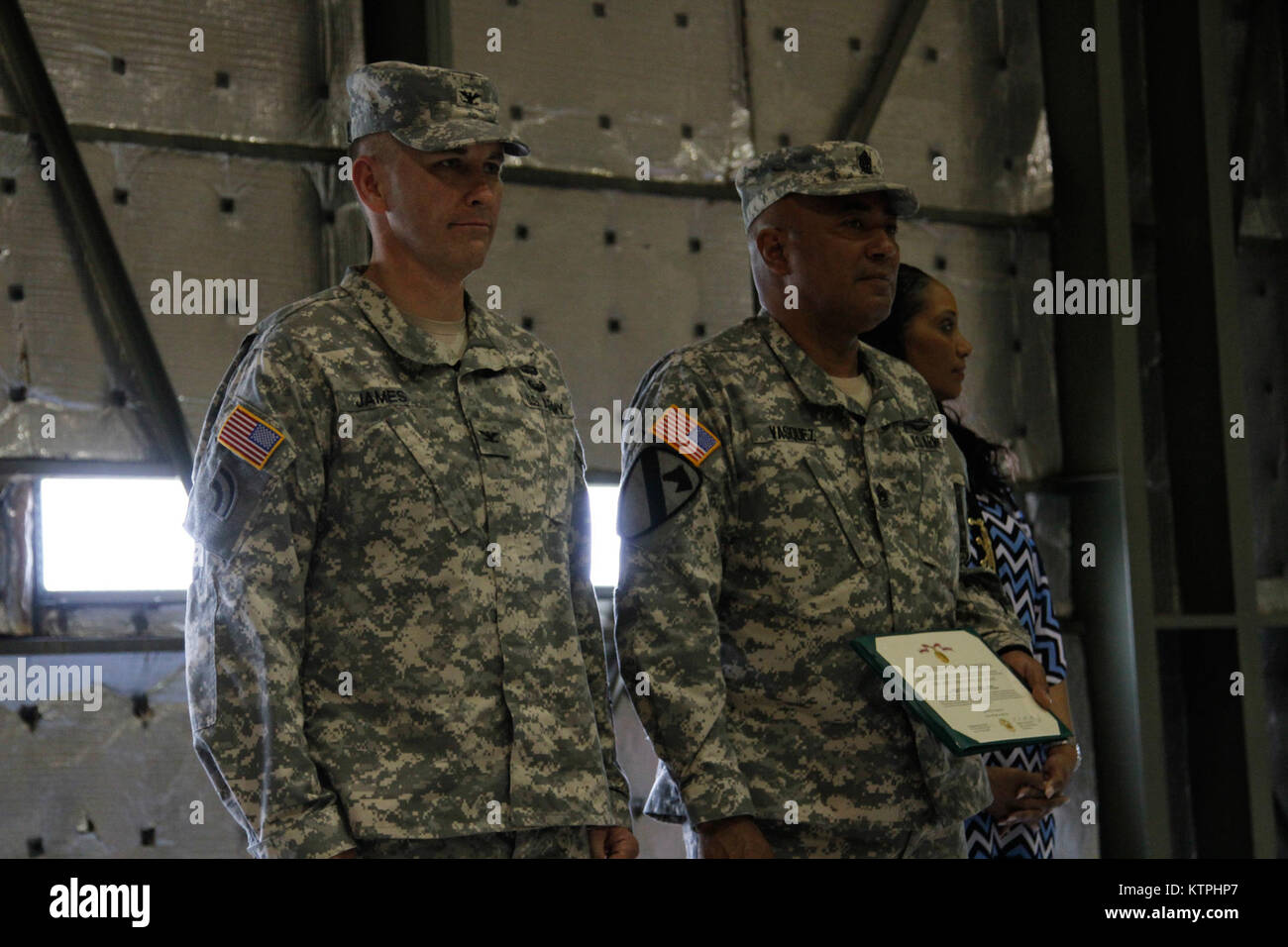 Col. Jack James, the 42nd Combat Aviation Brigade commander, presents ...