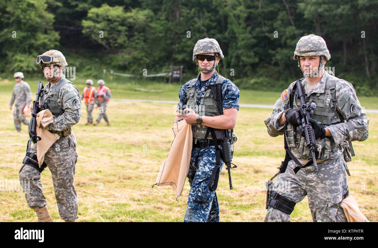 Service members compete in the Combat Rifleman Excellence-in ...