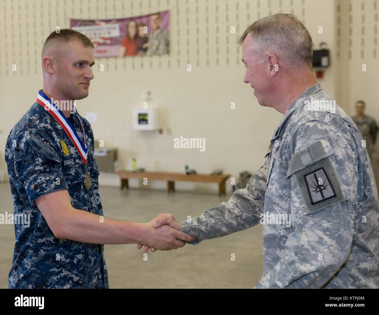 Petty Officer 2nd Class Mark Bruce poses with Brig. Gen. Michael Swezey ...