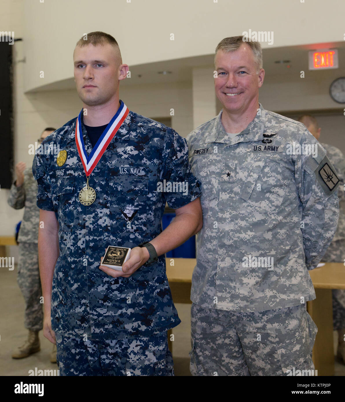 Petty Officer 2nd Class Mark Bruce poses with Brig. Gen. Michael Swezey ...