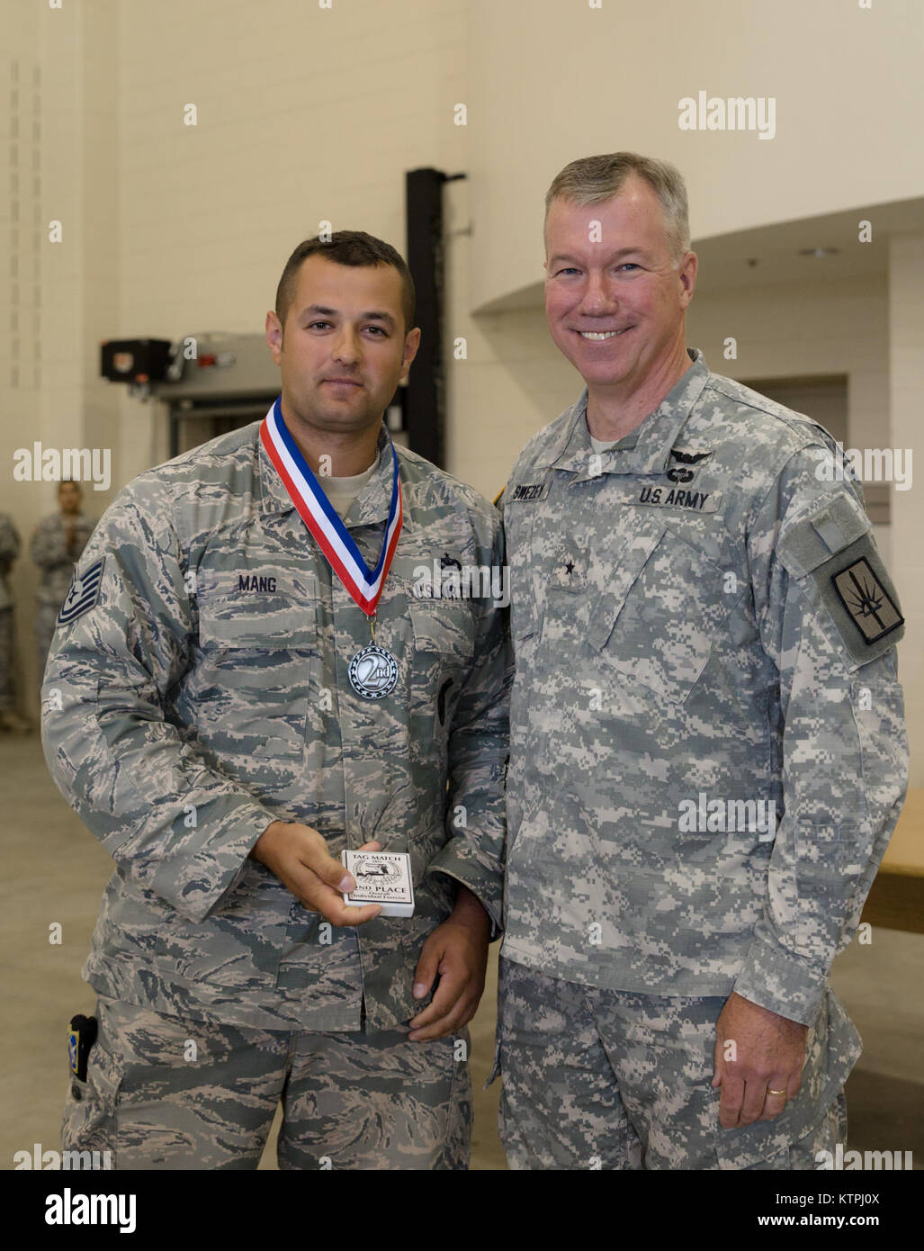 Tech. Sgt. Ryan Mang, of the 107th Airlift Wing, poses with Brig. Gen ...
