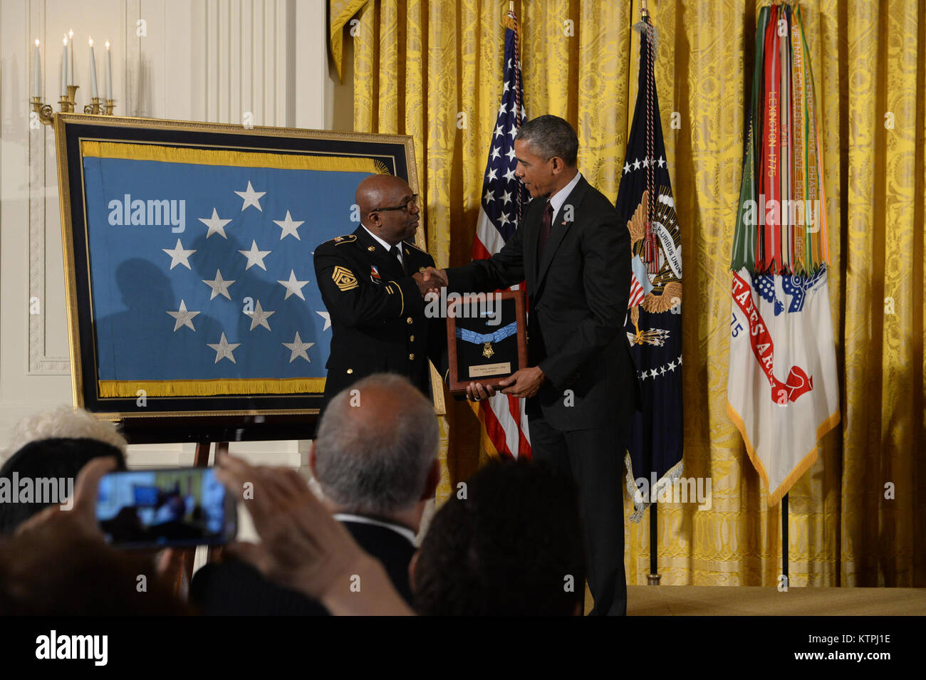 New York Army National Guard Command Sgt. Maj. Louis Wilson accepts the ...
