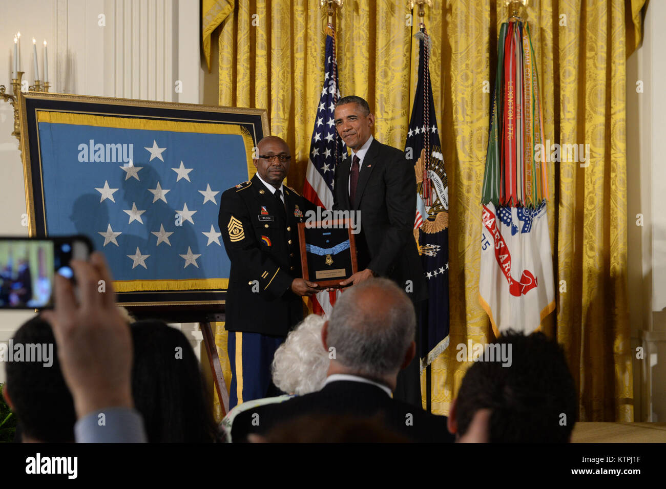 New York Army National Guard Command Sgt. Maj. Louis Wilson accepts the ...