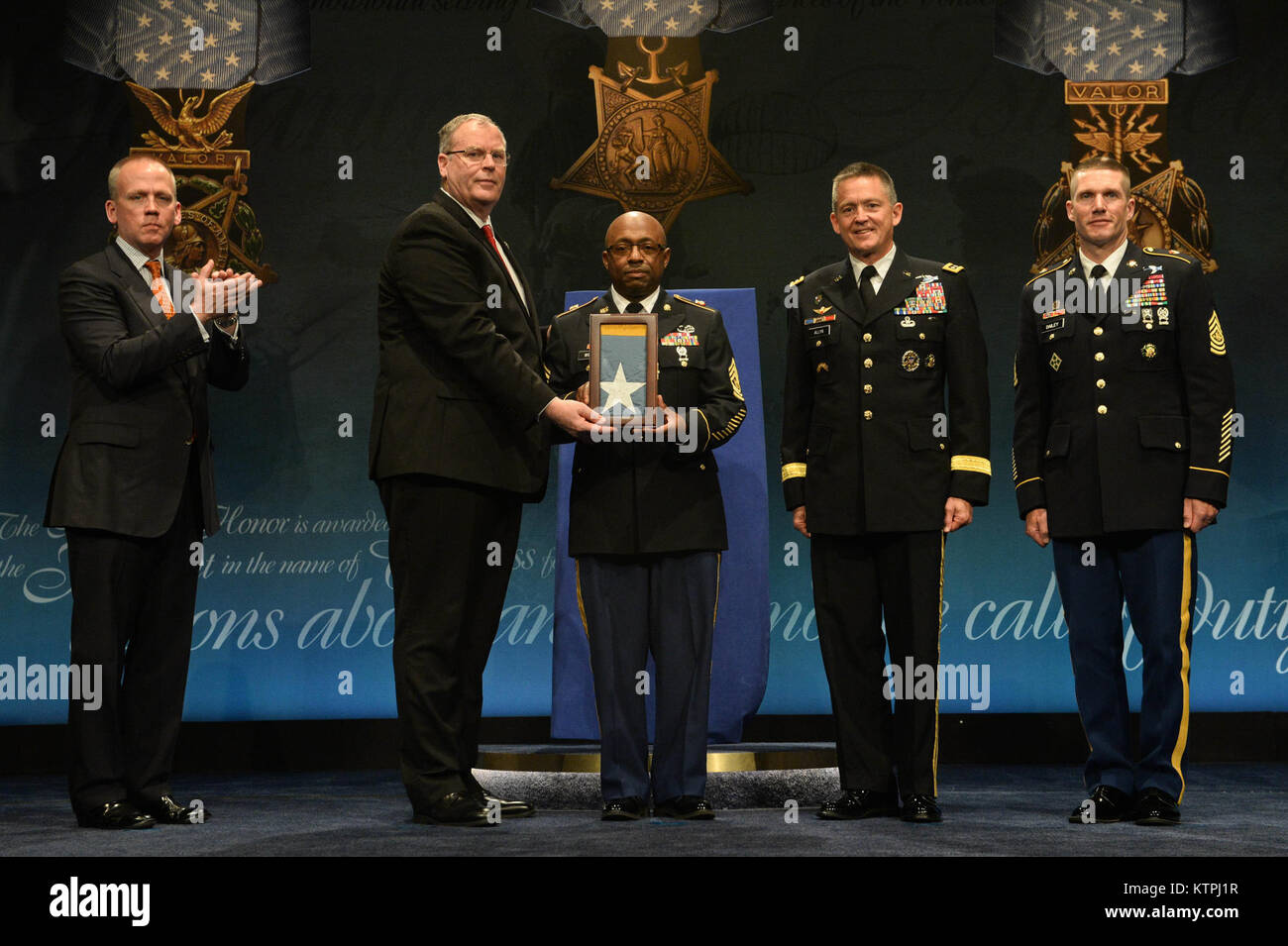 New York Army National Guard Command Sgt. Maj. Louis Wilson accepts the ...