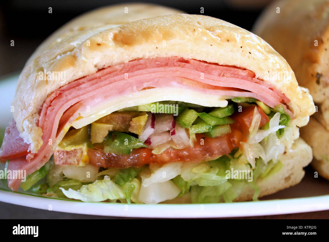 Sub sandwich with meats, cheese and fresh veggies Stock Photo - Alamy