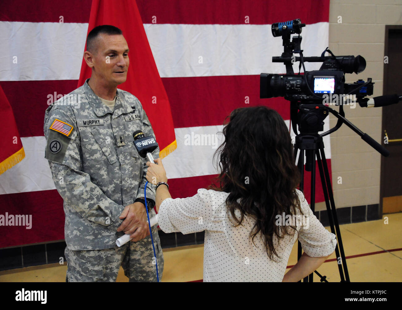 Maj. Gen. Patrick Murphy is interviewed by Time Warner Cable reporter ...