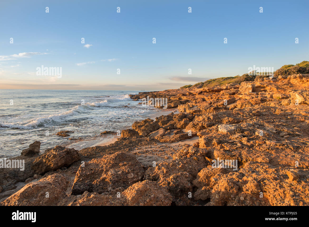 The calm sea in a very cloudy sunset in Spain Stock Photo - Alamy