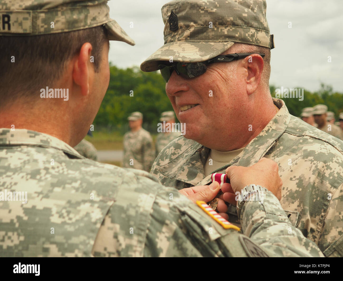 Sgt. Major Luis Martinez receives an award after 34 years of service to ...