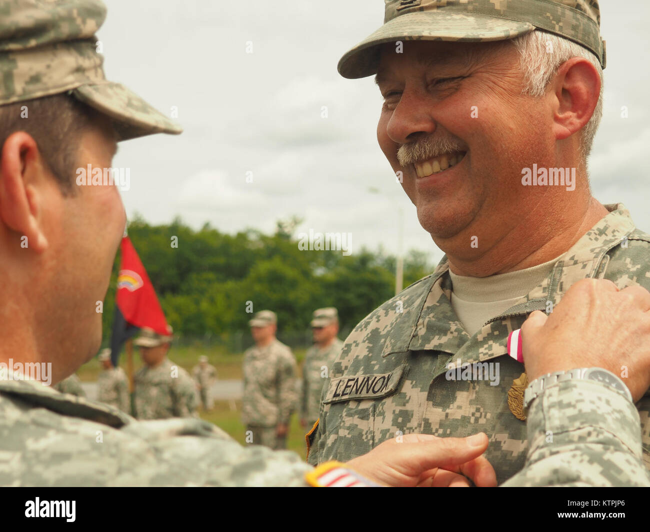 Sgt. Major Andrew Lennox receives an award after 39 years of service to ...