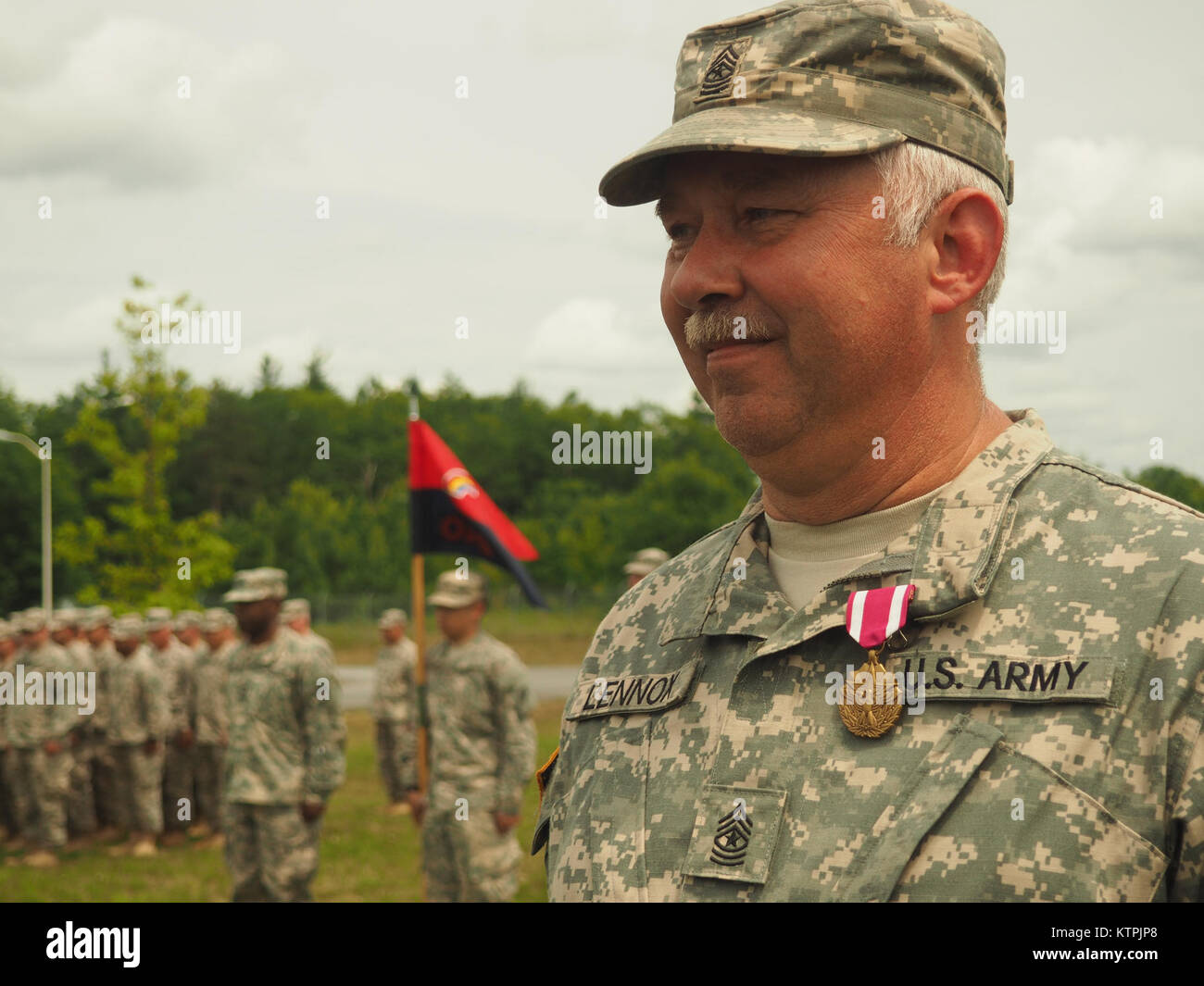 Sgt. Major Andrew Lennox receives an award after 39 years of service to ...