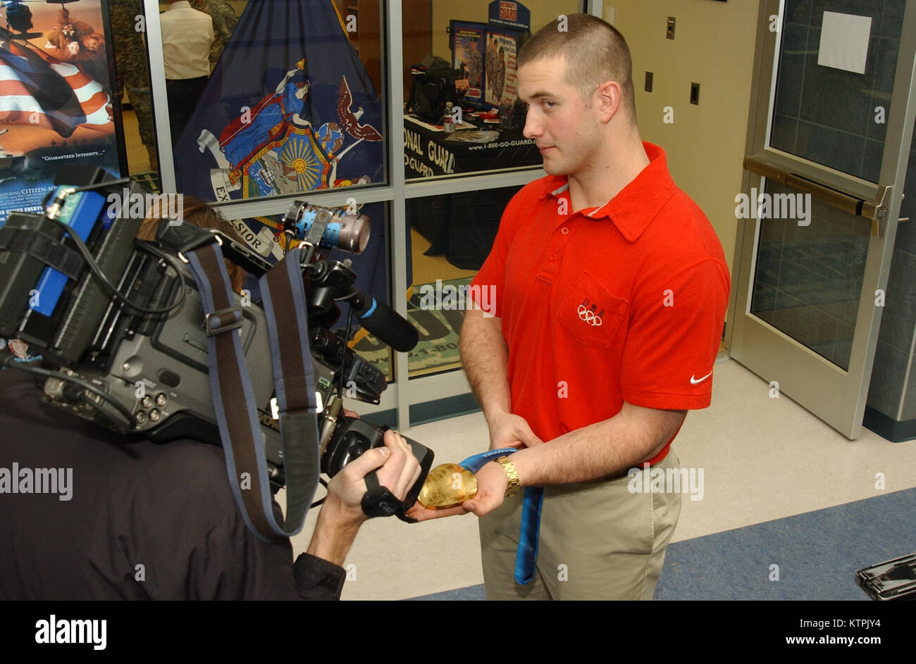 New York Army National Guard PFC Justin Olsen speaks with members of ...