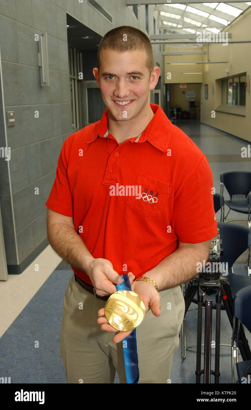 New York Army National Guard Sgt. Justin Olsen displays his Olympic ...