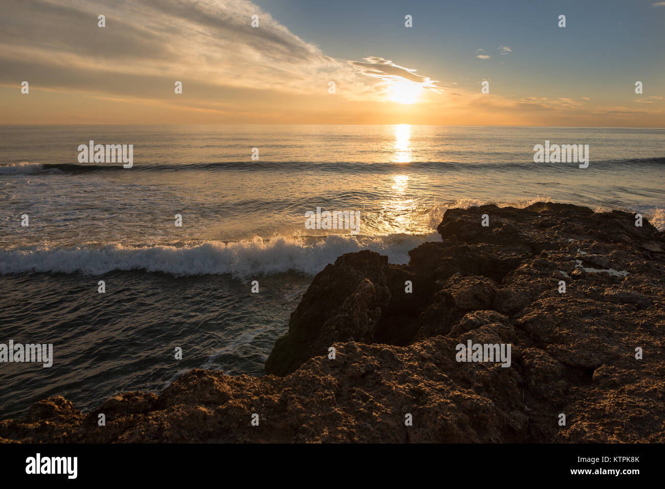 The calm sea in a very cloudy sunset in Spain Stock Photo - Alamy