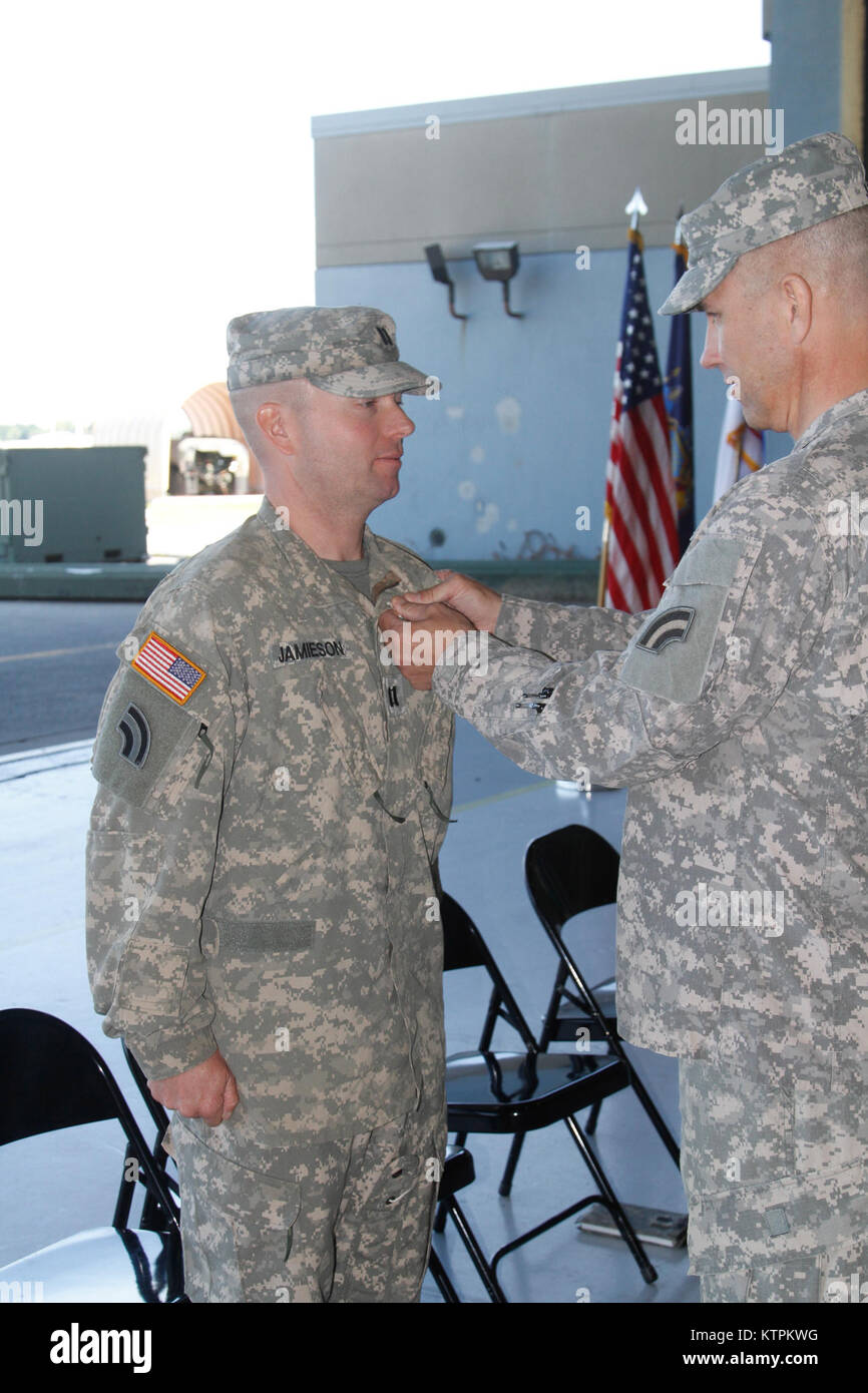 Col. Jack James, 42nd Combat Aviation Brigade commander, pins the Army ...