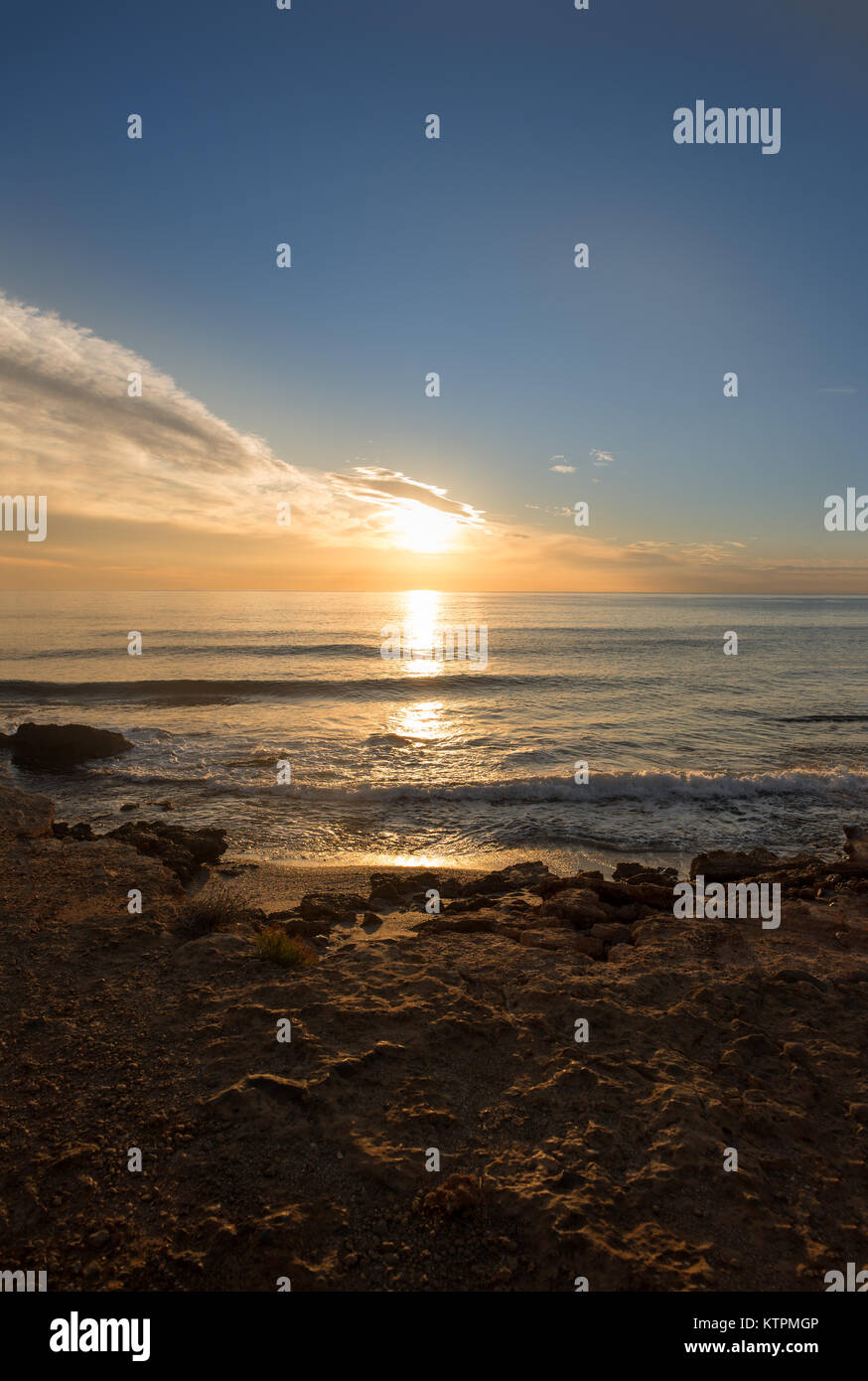 The calm sea in a very cloudy sunset in Spain Stock Photo - Alamy