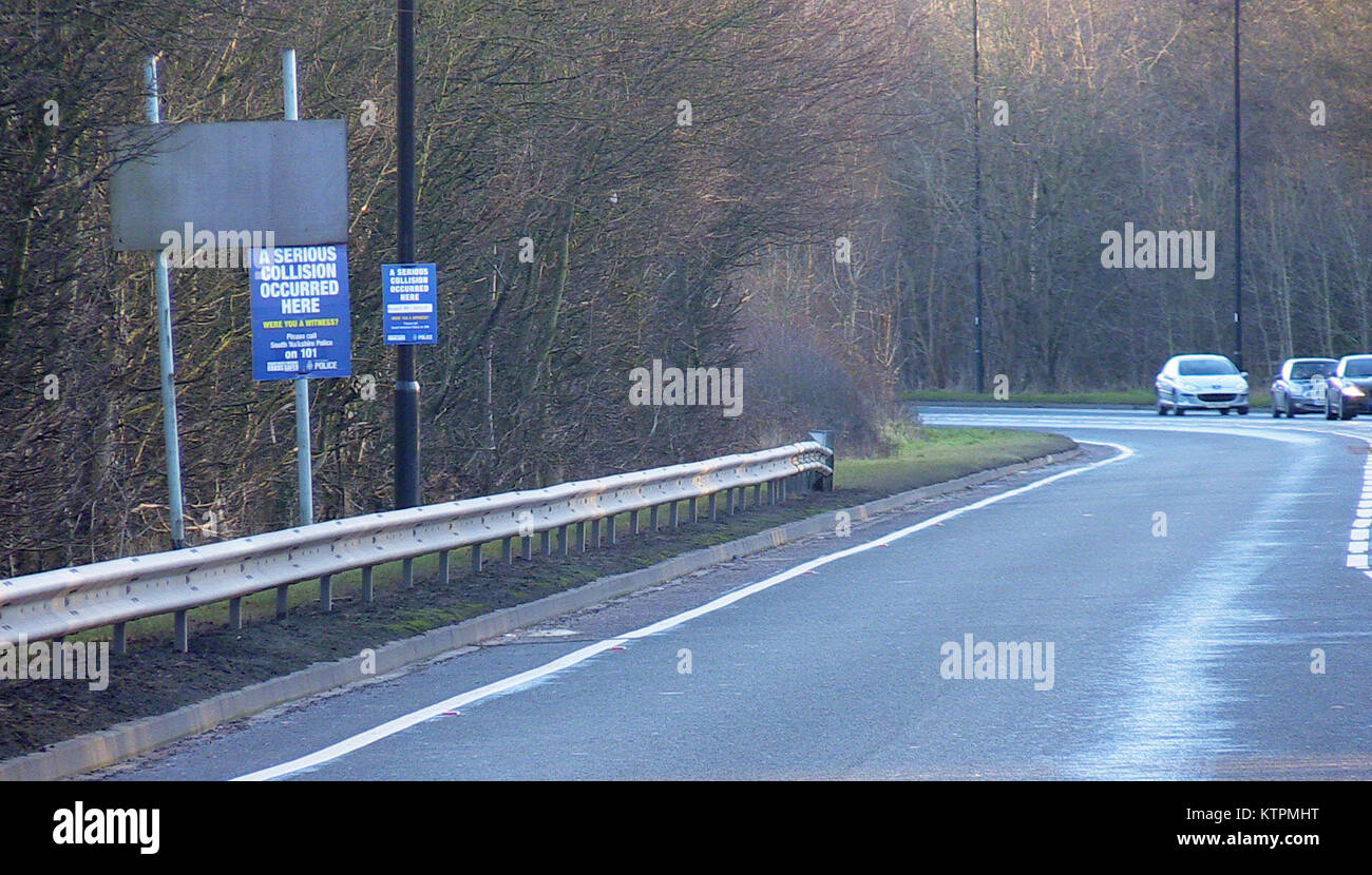 Witness appeal signs at the side of the road near the scene of a crash ...