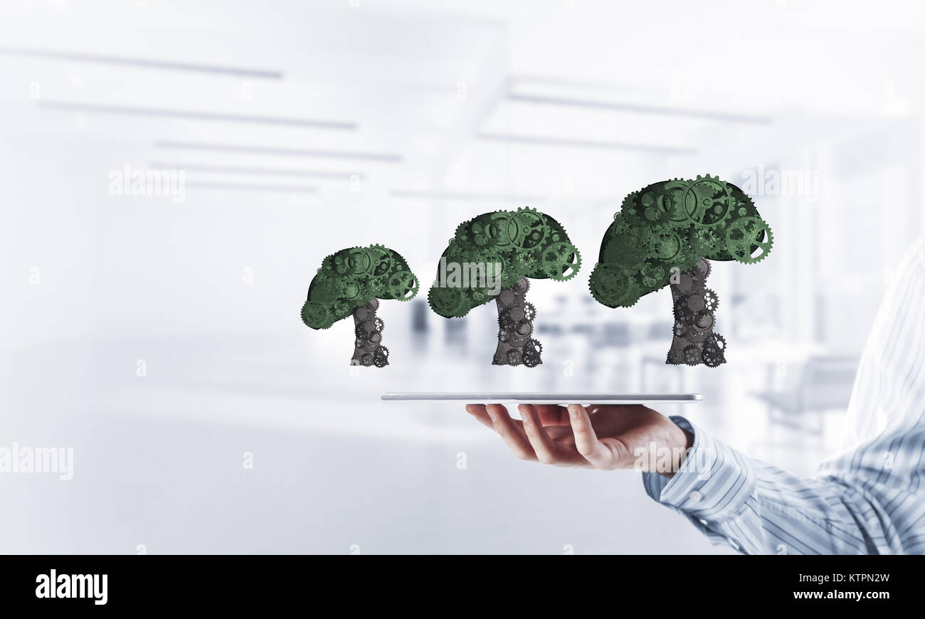 Eco green environment concept presented by tree as working mecha Stock ...