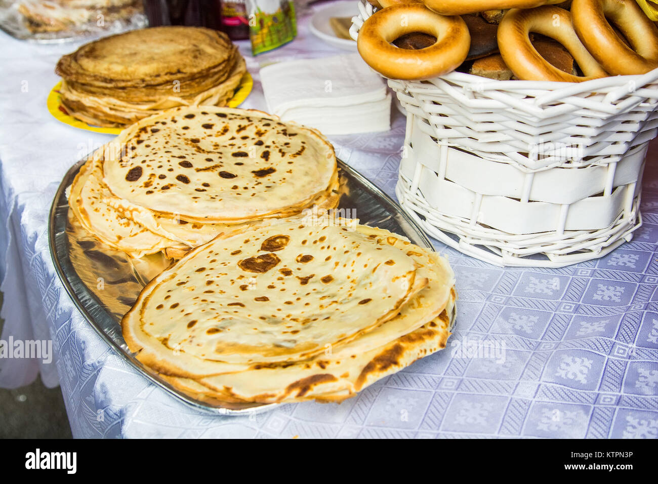 Pile of delicious pancakes on tray on table close-up Stock Photo - Alamy
