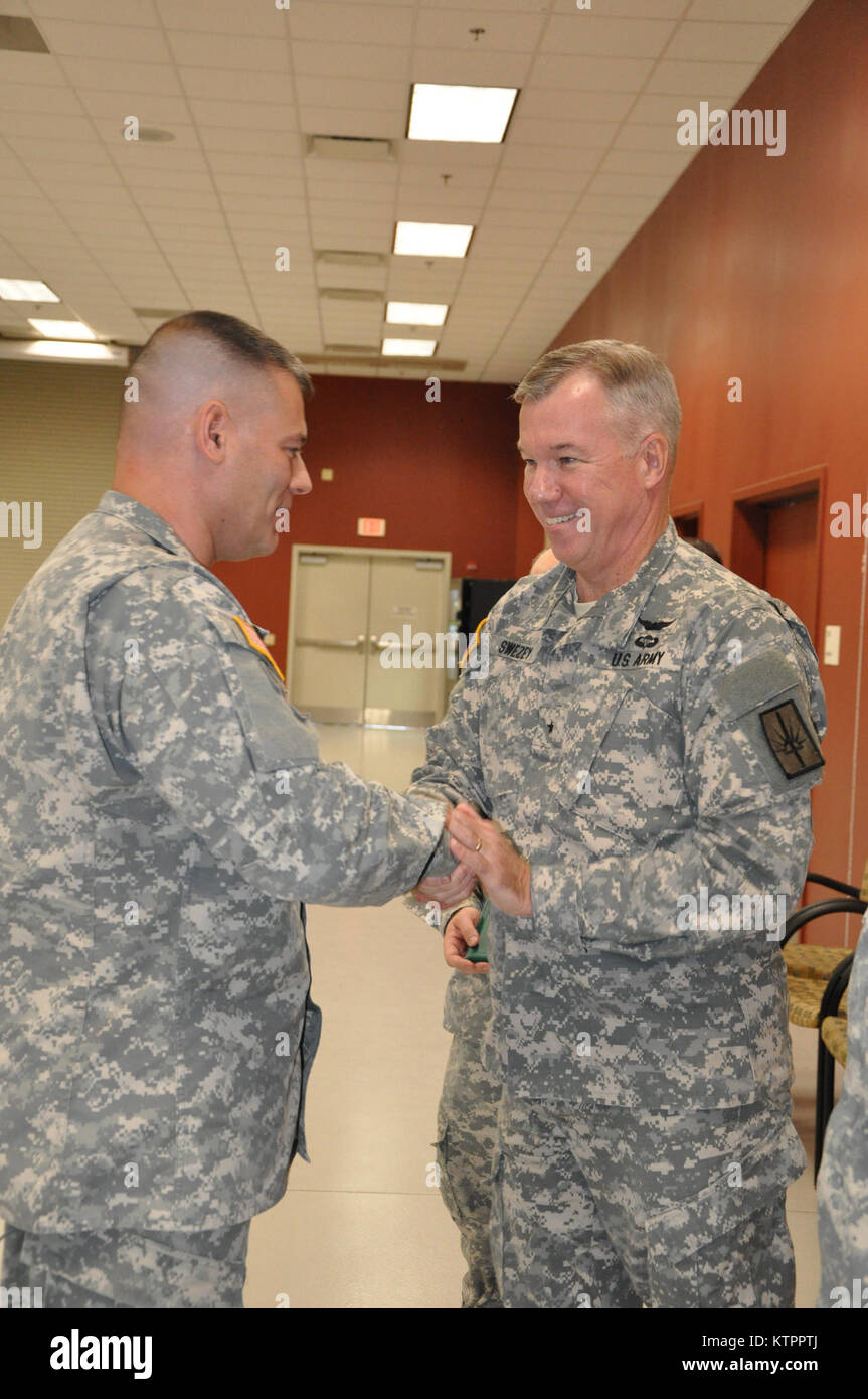 New York Army National Guard Lt. Col. Andrew Caliendo receives a ...