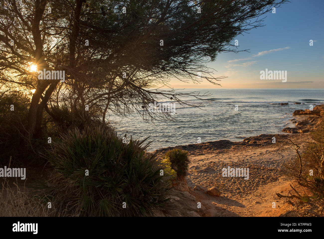 The calm sea in a very cloudy sunset in Spain Stock Photo - Alamy