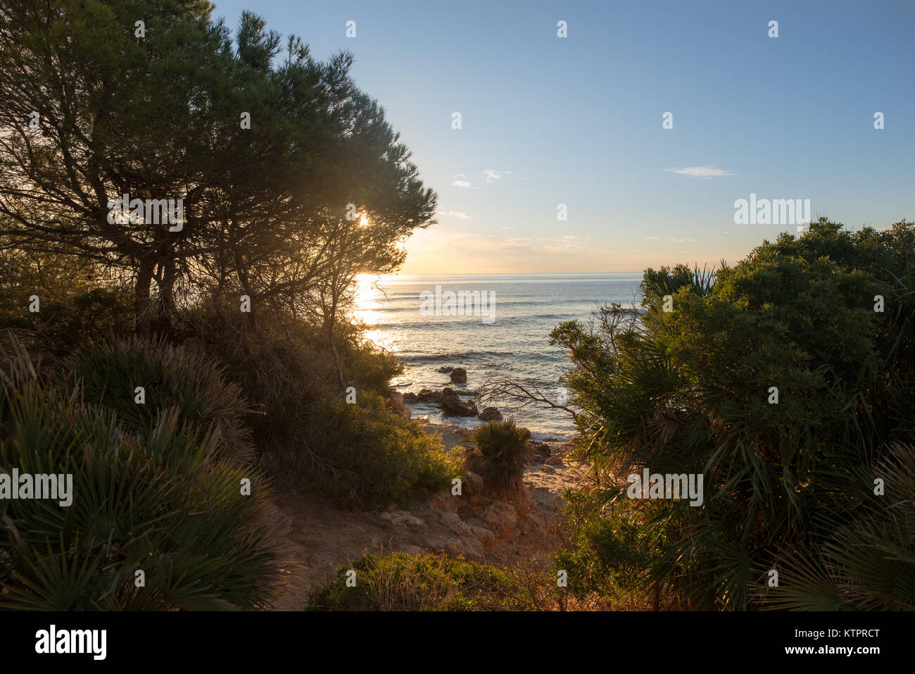 The calm sea in a very cloudy sunset in Spain Stock Photo - Alamy