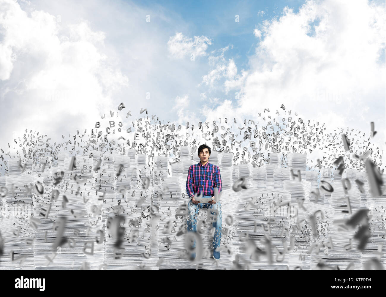 Attractive man sitting on pile of paper documents Stock Photo - Alamy
