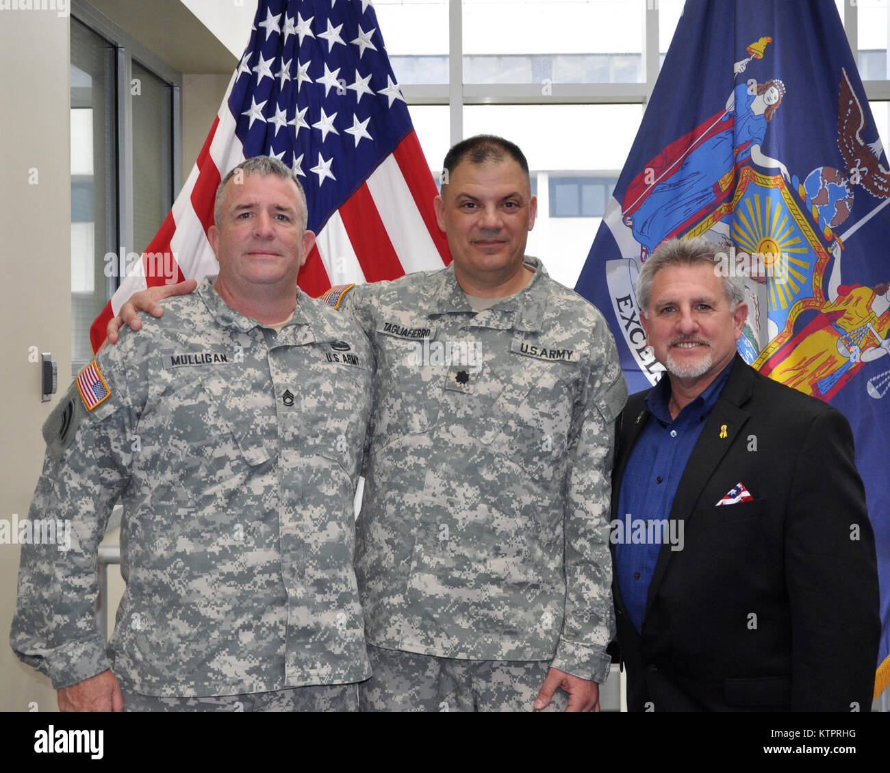LATHAM, N.Y. -- NYARNG Lt. Col. Micheal Tagliafierro poses with friends ...